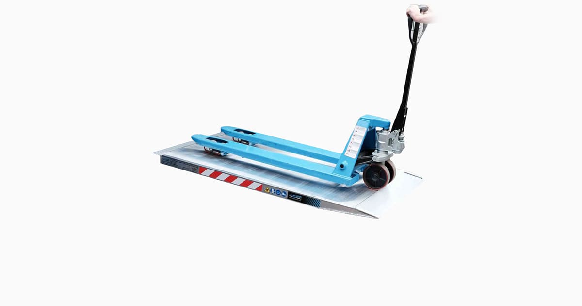 Ramp for loading pallets into shipping containers